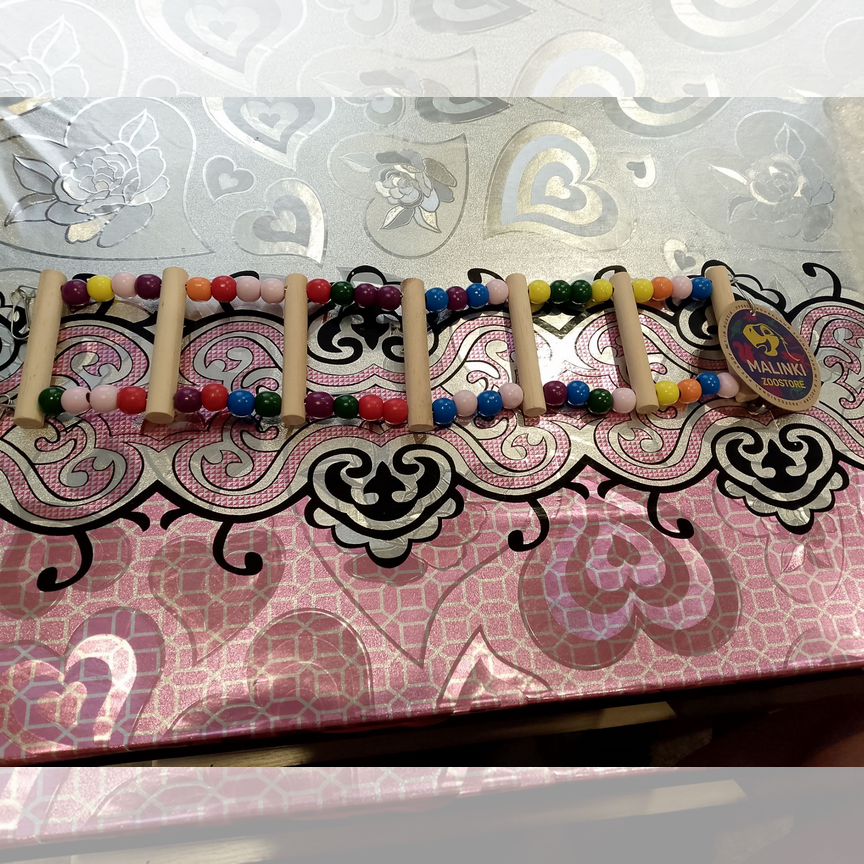 Игрушка для попугая